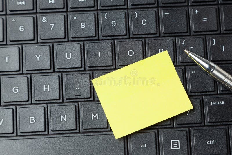 Mock-up Yellow Office Sticker on the Keyboard of Laptop Stock Photo ...