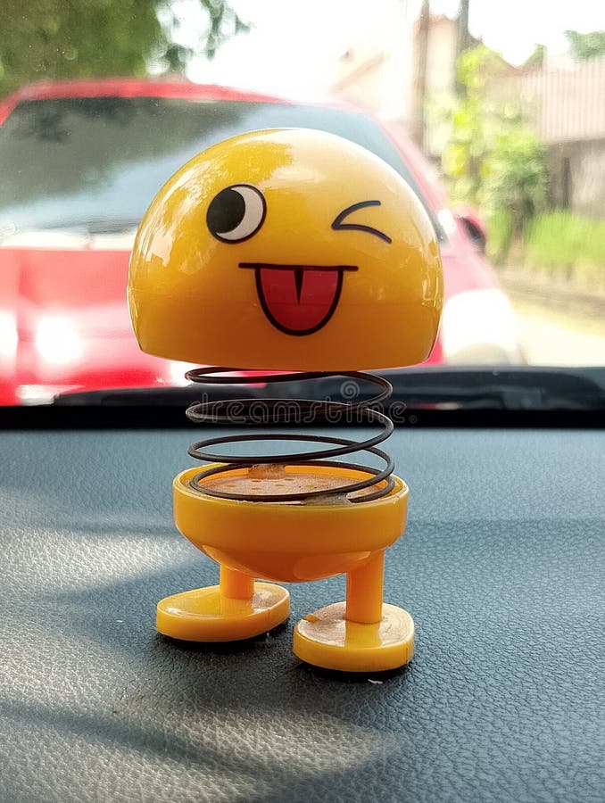 Mocking Emoji on the Car Dashboard Stock Image - Image of mocking ...