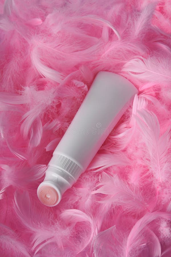 A Bottle of Detergent on a Pink Feather. Makeup. Stock Image - Image of ...