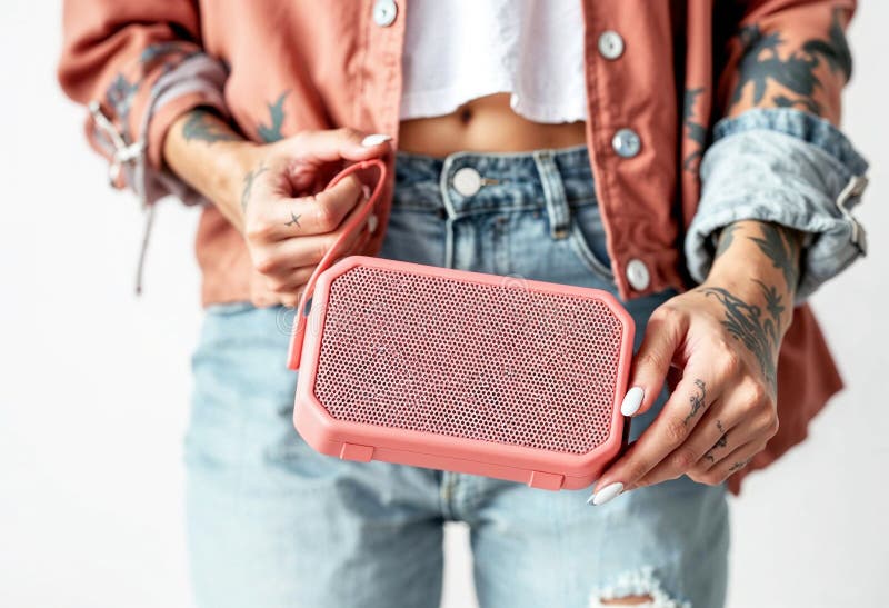 Stylish Pink Bluetooth Speaker Held by Tattooed Person Stock Image ...