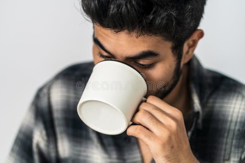 The Mockup Highlights a Man Displaying a White Blank Mug, Offering a ...