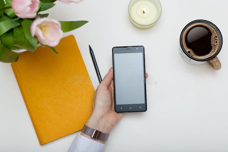 Mockup Image of Cell Phone in Female Hand. Design Creative Work Space ...