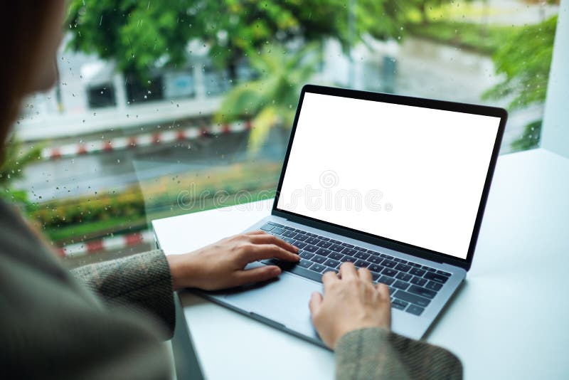 A Hand Using and Typing on Laptop Computer Keyboard with Blank White ...