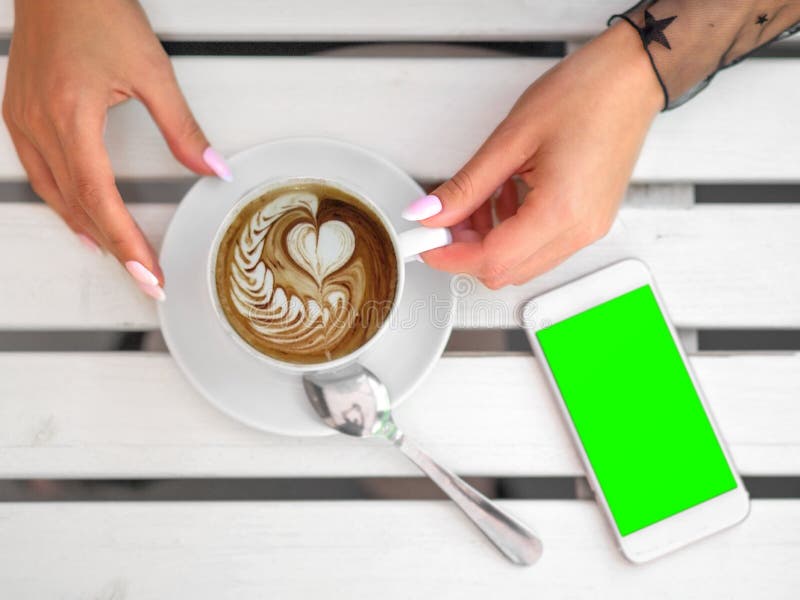 Mockup Image of White Mobile Phone with Green Screen and Hand Holding ...
