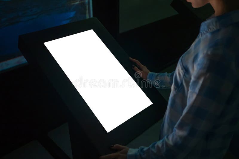 Mockup Image - Woman Looking at White Blank Touchscreen Display Kiosk ...