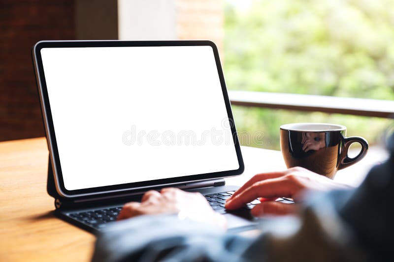 A Woman Using and Typing on Digital Tablet Keyboard with Blank White ...