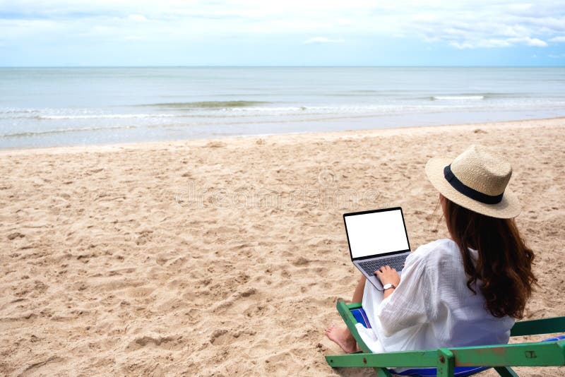 A Woman Using And Typing On Laptop Computer With Blank Desktop Screen ...