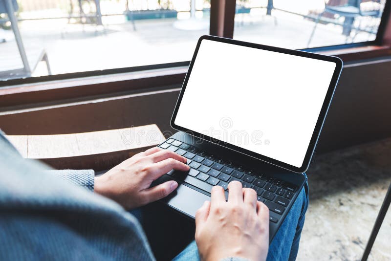 A Woman Using and Typing on Tablet Keyboard with Blank White Desktop ...