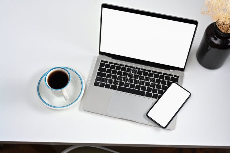 Laptop Computer, Smart Phone, and Coffee Cup on White Table. Stock ...