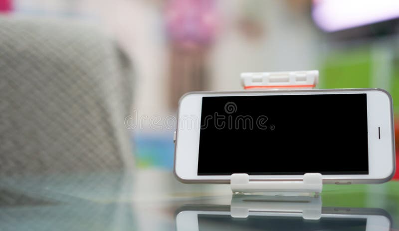 Mockup of Screen of Smartphone on Docking on Table Stock Image - Image ...