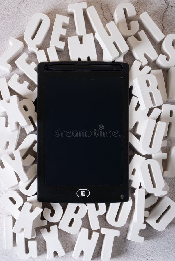 Mockup Tablet among Three-dimensional Letters Made of Plaster. Concept ...