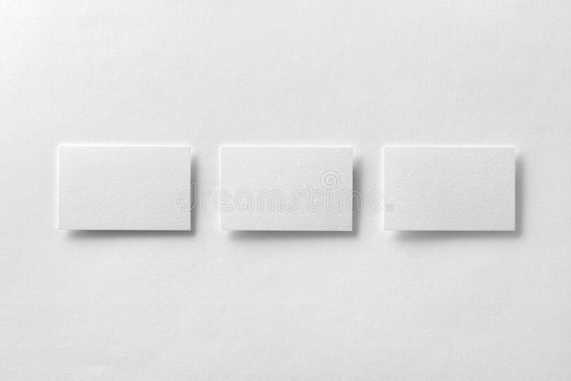 Mockup of Three Business Cards Row at White Textured Paper Background ...