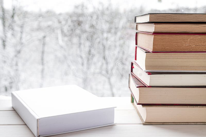 White Clean Pages of Open Book Against the Backdrop of Old Books and ...