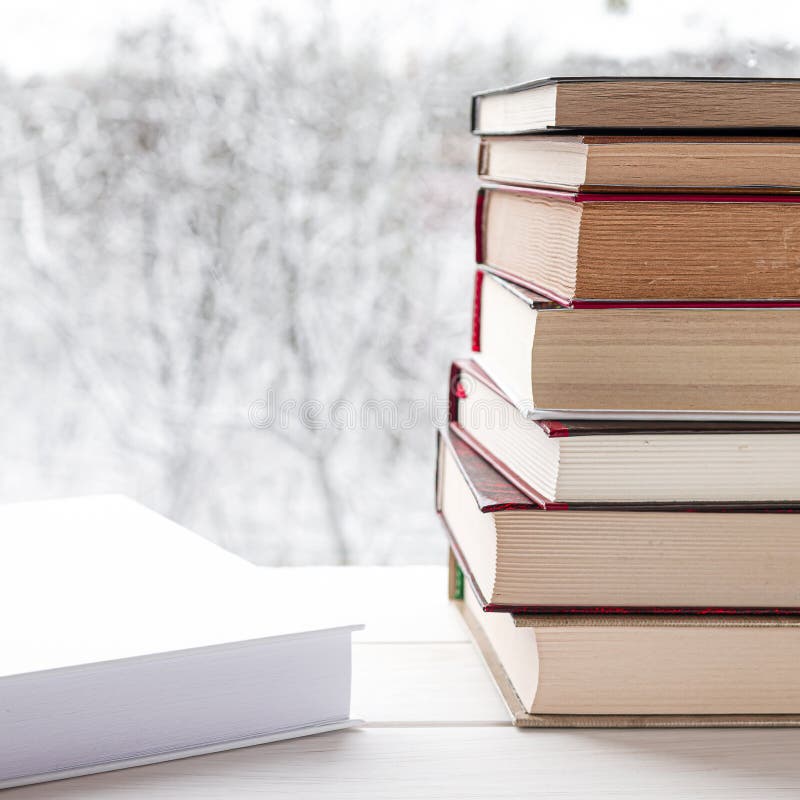 White Clean Pages of Open Book Against the Backdrop of Old Books and ...