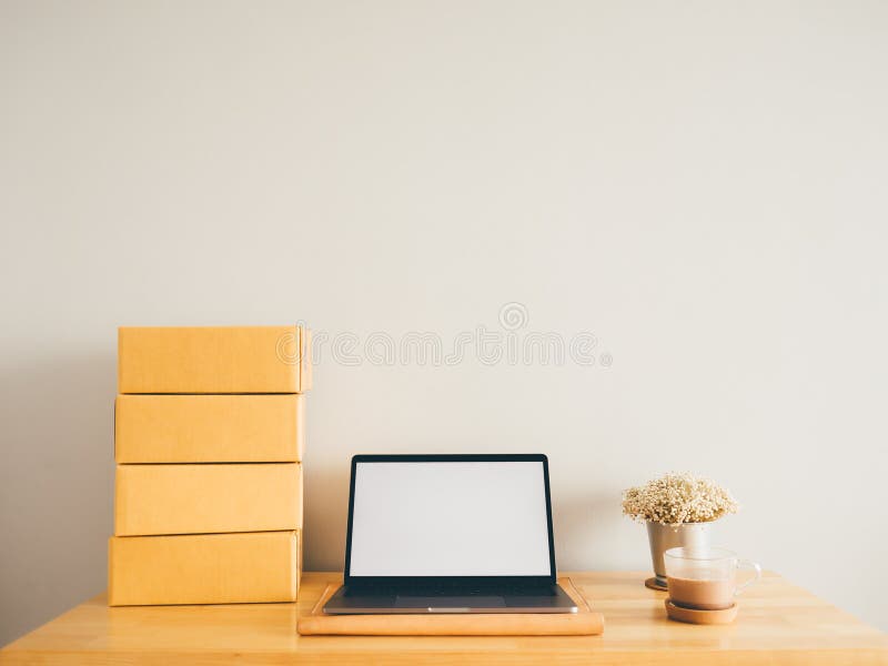 Mockup of White Empty Display Laptop with Boxes on Table. Concept of ...