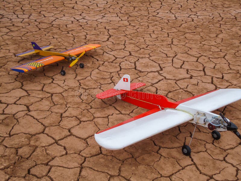 Model Airplane on a Desert Floor in Red Stock Photo - Image of ground ...