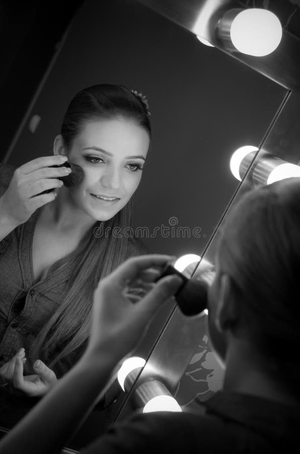 Model applying makeup stock photo. Image of female, beautification ...