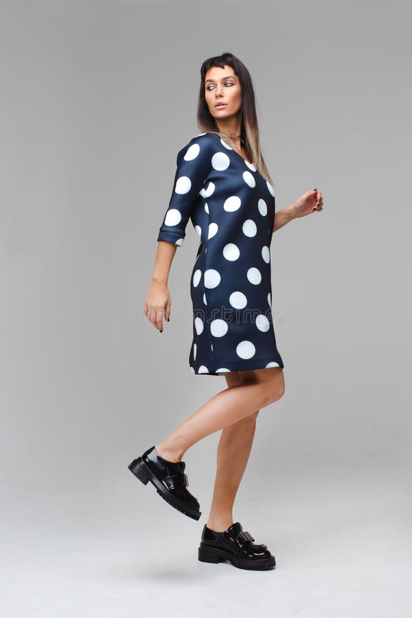 Model in Blue Dress with Polka Dots Making Steps Stock Image - Image of ...