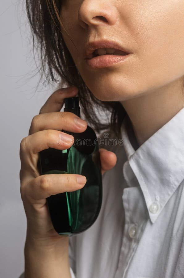 Model and a Bottle of Perfume Stock Photo - Image of portrait, makeup ...