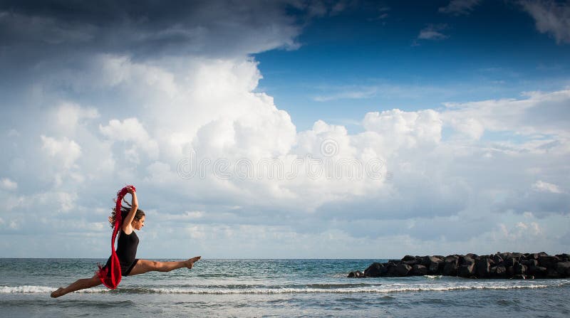 Model dancing on the beach stock photo. Image of dance - 77442958
