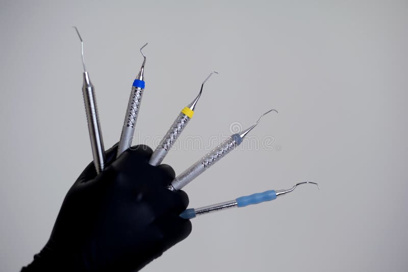 Model of Dentures and Dental Instruments in Hands of Dentist. Dental ...