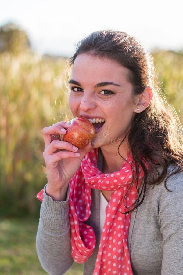 Model eating an apple stock image. Image of field, healthy - 75262187