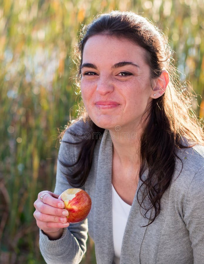 Model eating an apple stock image. Image of young, teen - 75262501