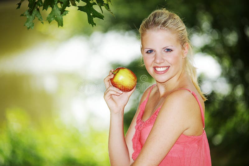 Model eating an apple stock image. Image of beautiful - 39188707
