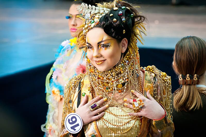 Model in Gold Walks the Runway during Editorial Image - Image of ...