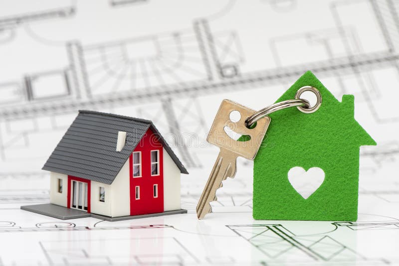 Model Home with Key Standing on Construction Plan Stock Photo - Image ...