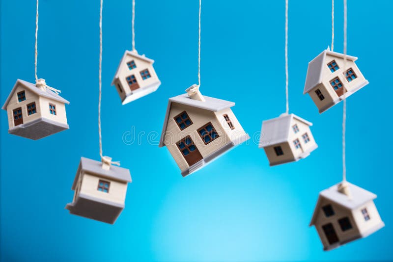 Model Houses Hanging by Strings Stock Photo - Image of blue, closeup ...