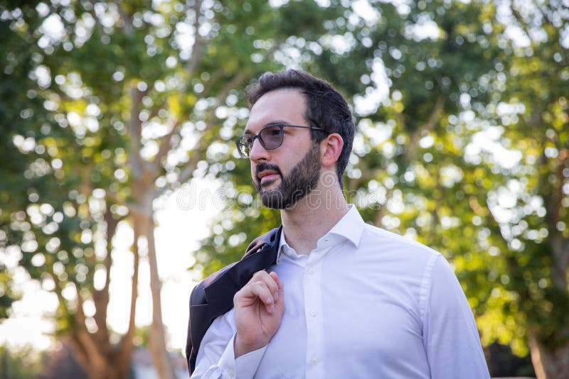 Model, with Jacket Over His Shoulders Gets Some Fresh Air at the Public ...