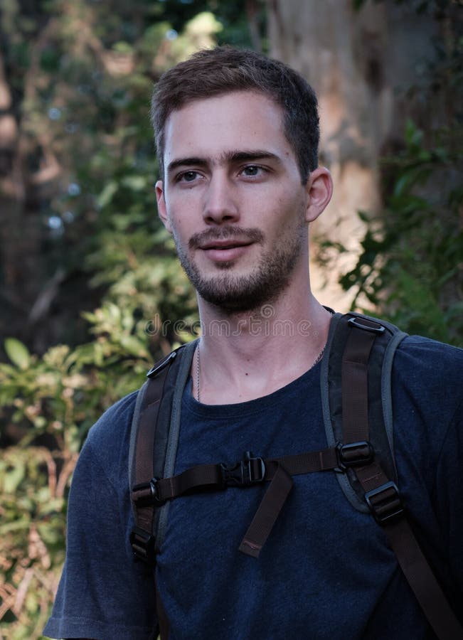 Man Dressed As a Hiker or Walker with a Background of Trees and ...