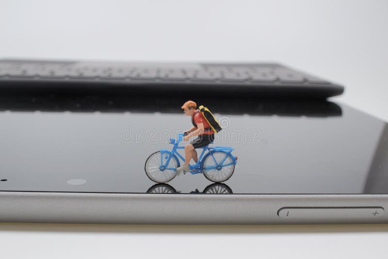 A Model of Man Riding His Bike on the Laptop PC Keyboard Stock Image ...