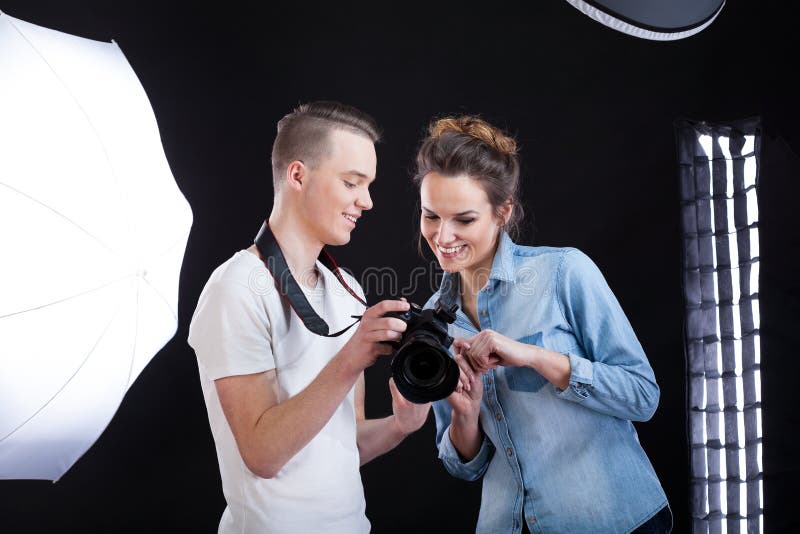 Photographer Looking into Viewfinder of Digital Camera Stand on Tripod ...