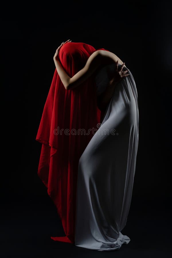 Model Posing Elegantly in a Dramatic Fashion Setting with Flowing ...