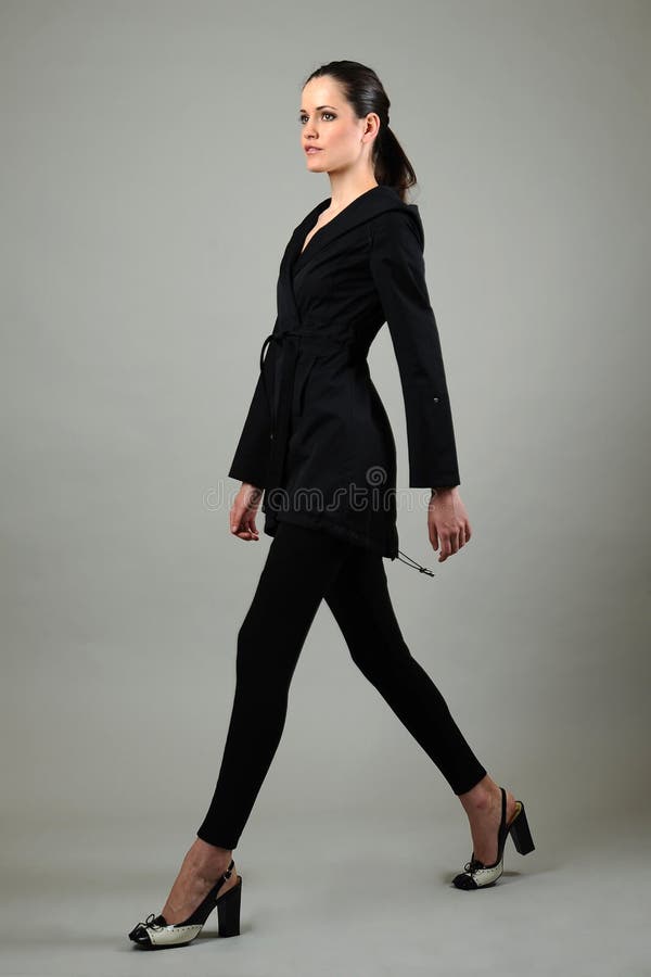 Elegant Woman in Business Black Suit Walking Away. Rear View Stock ...