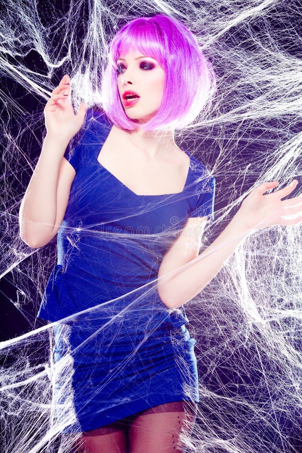 Model with Purple Wig and Intense Make-up Trapped in a Spider Web Stock ...