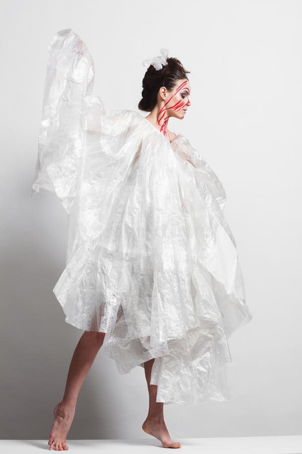 Model in a Raincoat Made of Cellophane and in Creative Make-up Stock ...