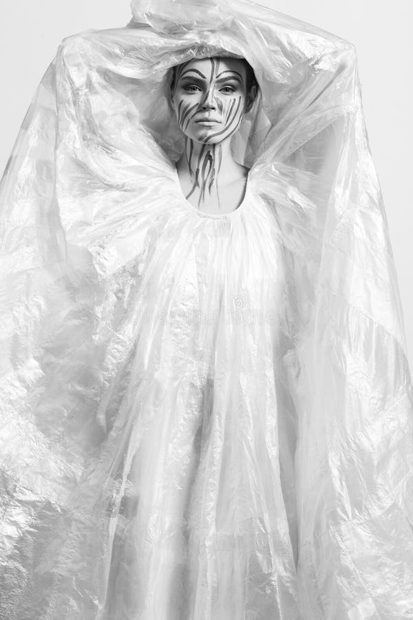 Model in a Raincoat Made of Cellophane and in Creative Make-up Stock ...