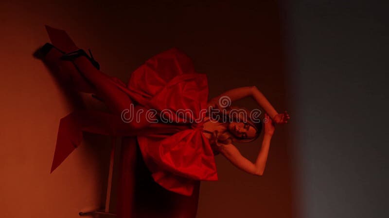 Model in Red on the Background of a Red Spotlight Stock Footage - Video ...