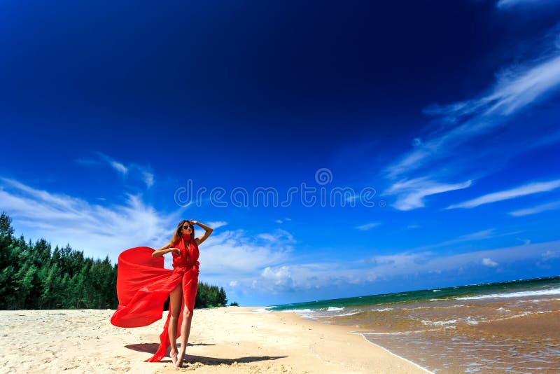 Model in Red Dress Posing on Beach Stock Photo - Image of caucasian ...