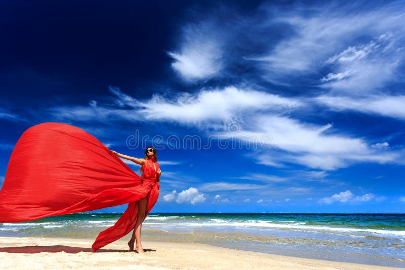 Model in Red Dress Posing on Beach Stock Photo - Image of posing ...