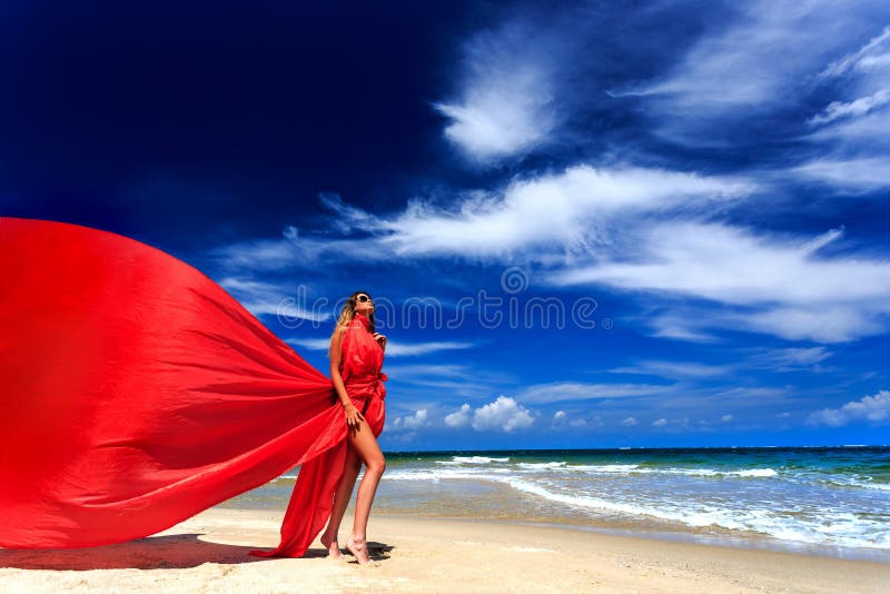 Model in Red Dress Posing on Beach Stock Photo - Image of female ...