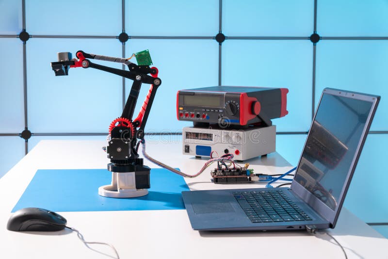 Model of a Robot and a Laptop on a Table in a Design Office Stock Photo ...