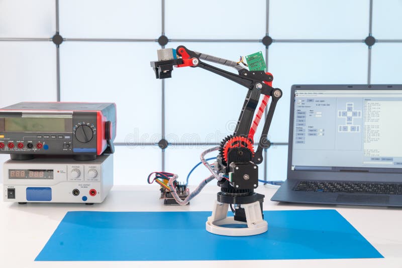 Model of a Robot and a Laptop on a Table in a Design Office Stock Image ...