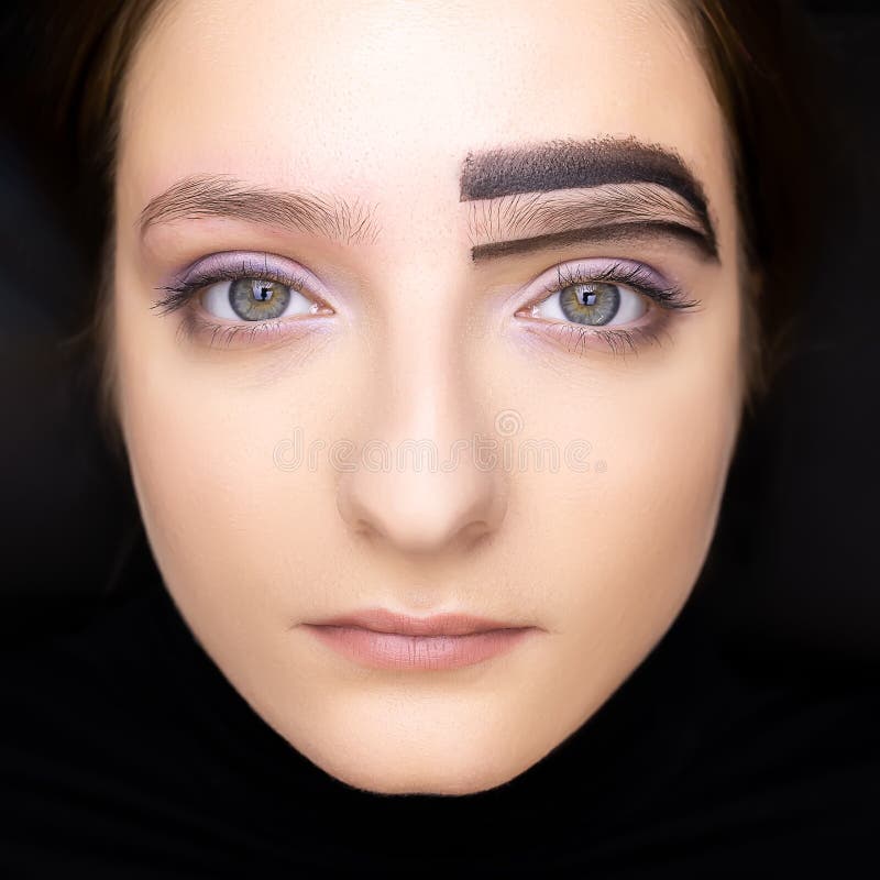 Model`s Face with Eyes Closed Black Brow Paste Applied Around the ...