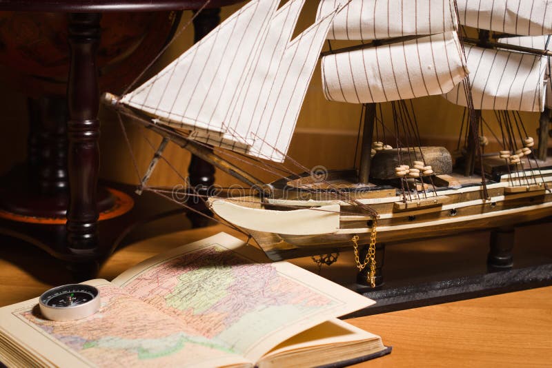Model Sailing Ship, Map Book and Compass Stock Photo - Image of south ...