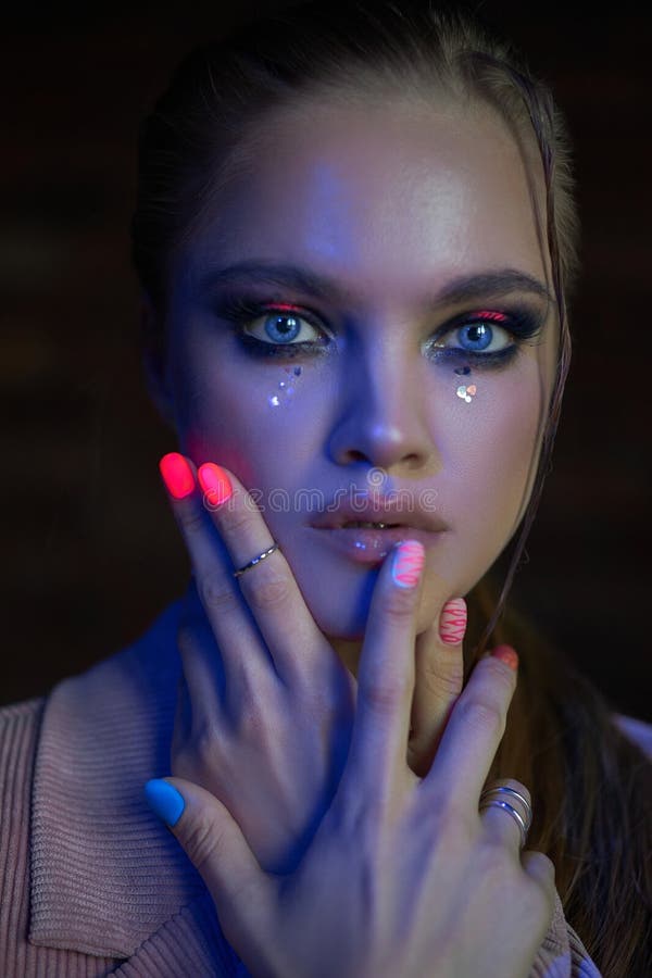 Model Showcases a Captivating Expression with Bold Eye Makeup and ...