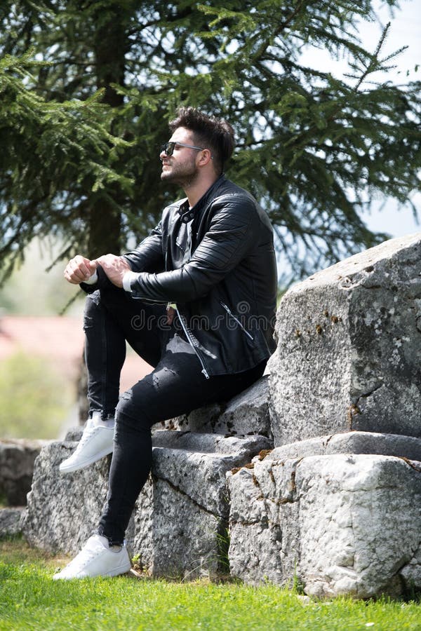 Model Sits Down Strong Outdoors in Nature Posing Stock Image - Image of ...